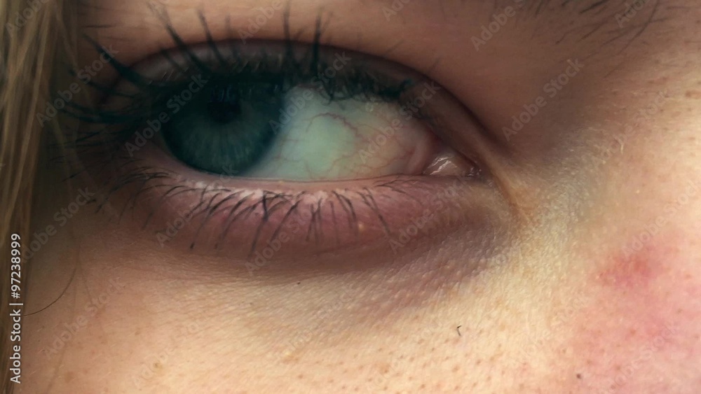 open female blue eye in 1080p a beautiful girl staring into the camera ...