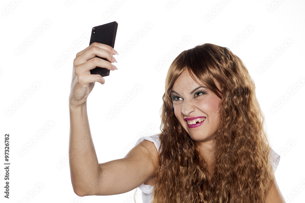 ugly toothless woman takes selfies on a white background Stock Photo ...
