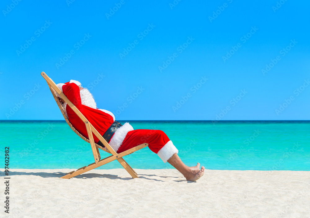 Christmas Santa Claus sunbathe in deckchair at ocean tropical beach ...