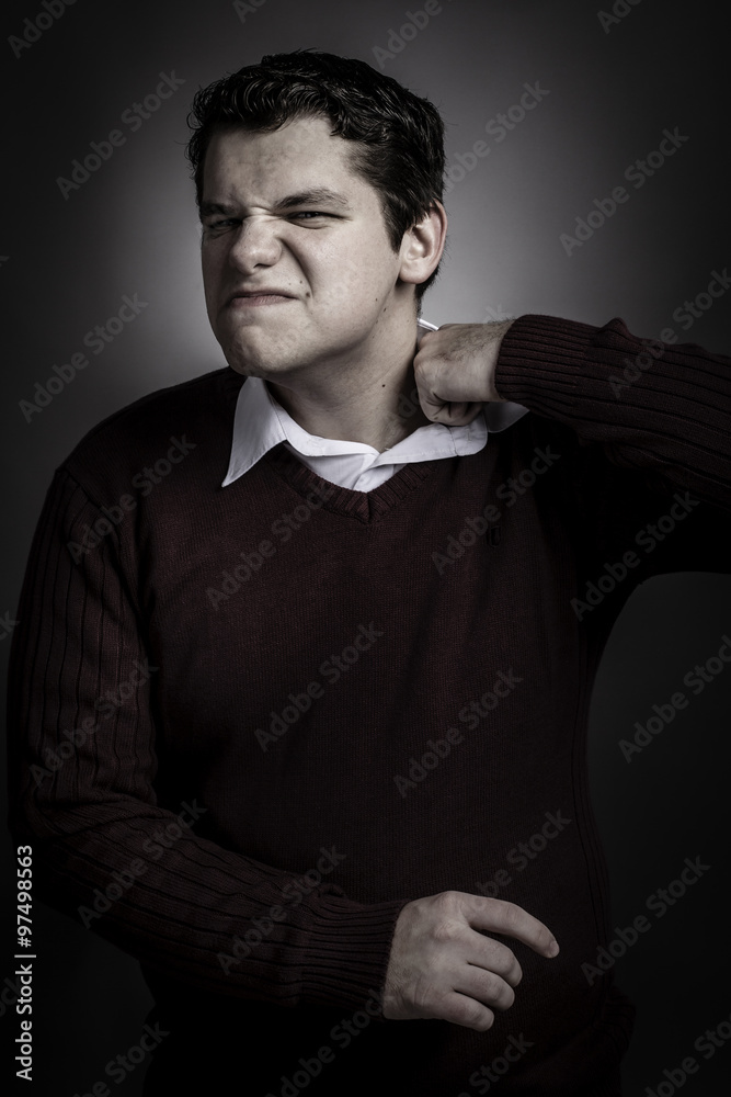 Man pulling his shirt Stock Photo | Adobe Stock
