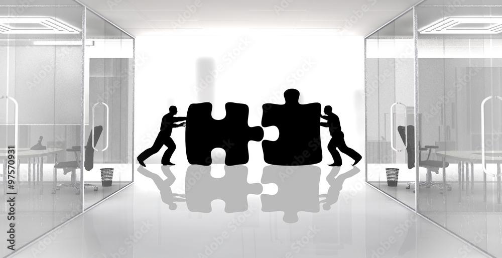 Concept of two workers assembling jigsaw pieces. Two team members are ...