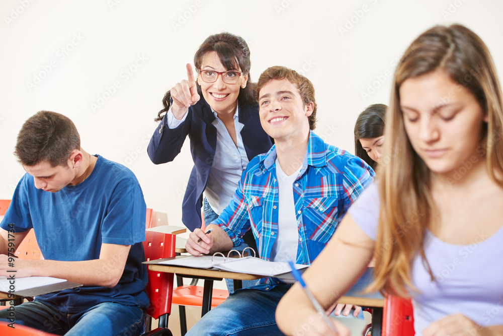 Lehrerin mit Schüler im Unterricht Stock Photo | Adobe Stock