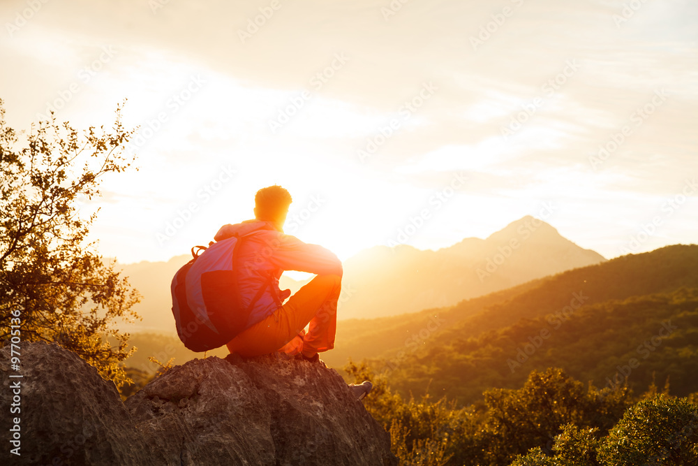 Hiker stands on the cliff over the sunrise Stock Photo | Adobe Stock