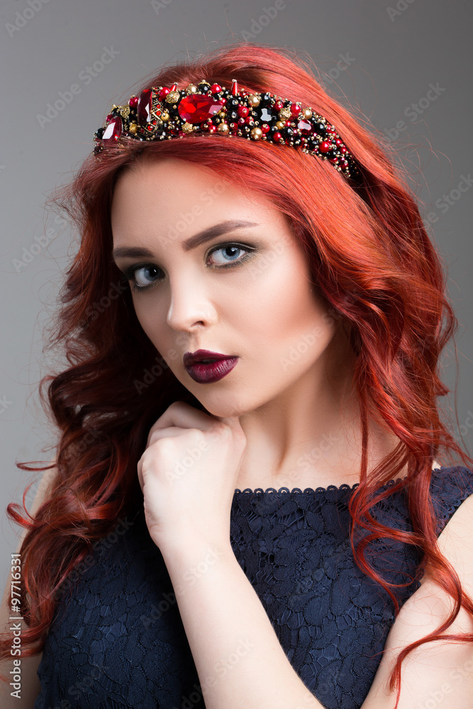 Beautiful red-haired fashion model posing in evening dress and in the ...