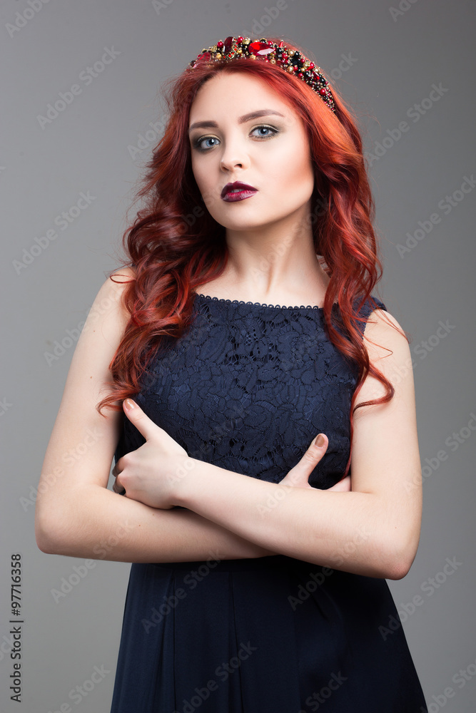 Beautiful red-haired fashion model posing in evening dress and in the ...