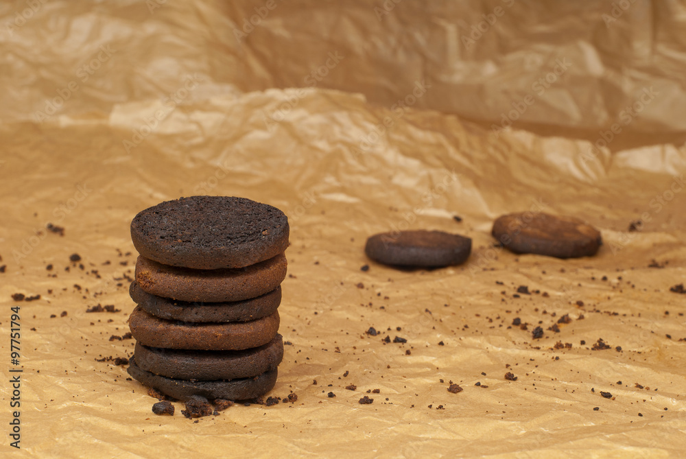 Burnt cookies with crumbs on backing crumpled paper. Stock Photo ...