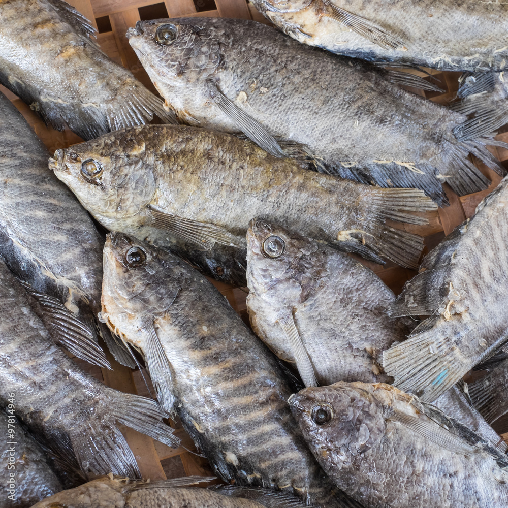 Dried Trichogaster pectoralis fish on threshing basket Stock Photo ...