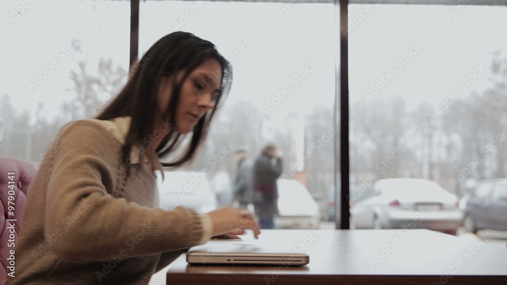 Woman comes, opens the laptop and starts working Stock Video | Adobe Stock