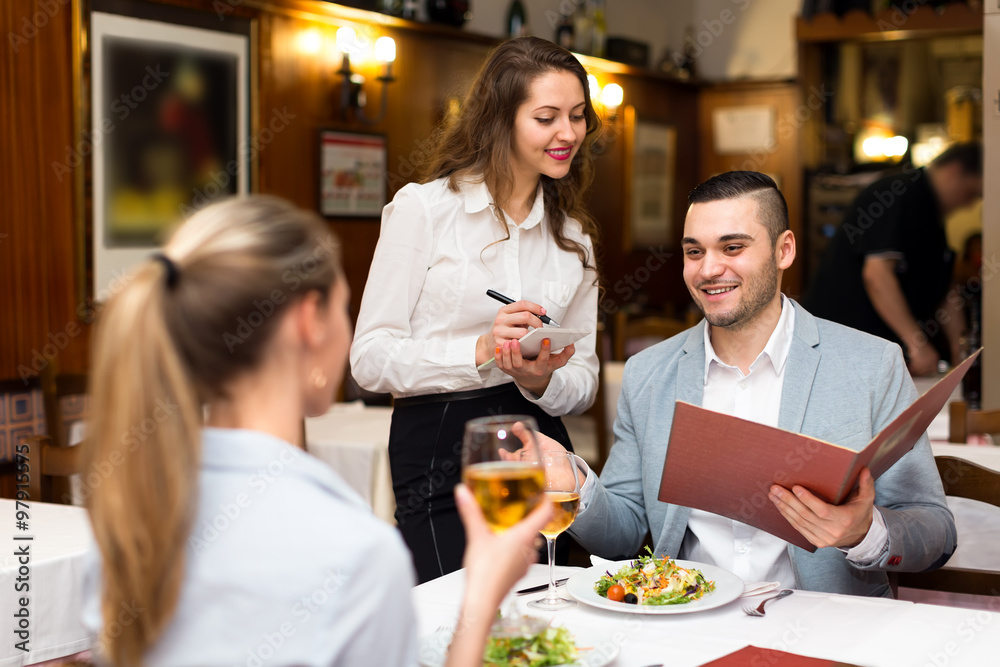 Beautiful waitress taking an order Stock Photo | Adobe Stock