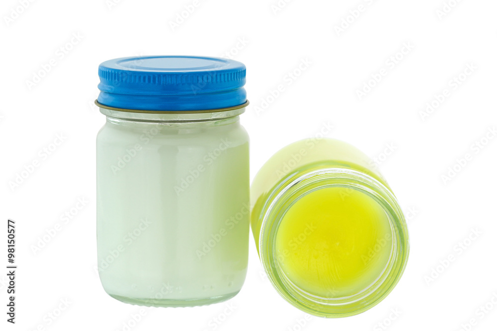 Jars of different formulas of Thai balm in yellow and white color ...