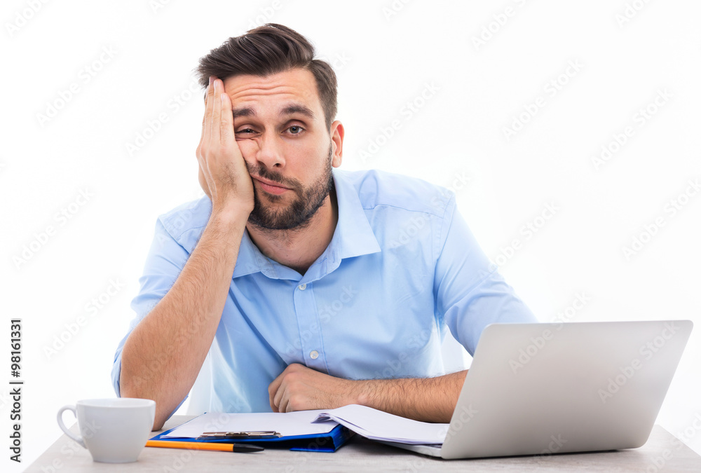 Bored young man at the desk Stock Photo | Adobe Stock
