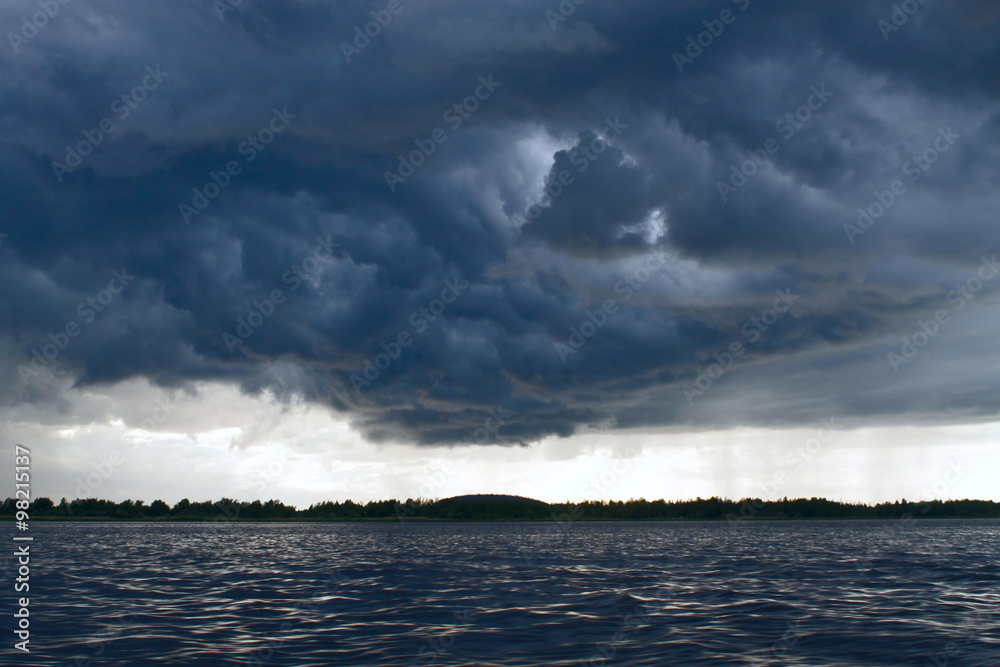 Storm Clouds Gathering Over Water