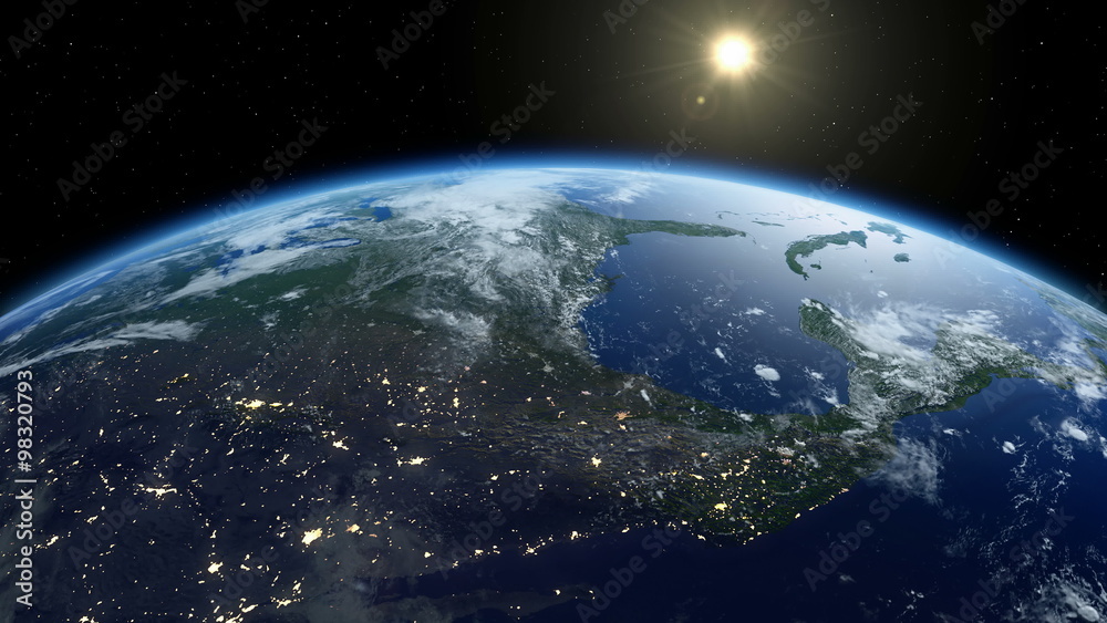Earth from orbiting satellite. Beautiful sunrise over North America and ...