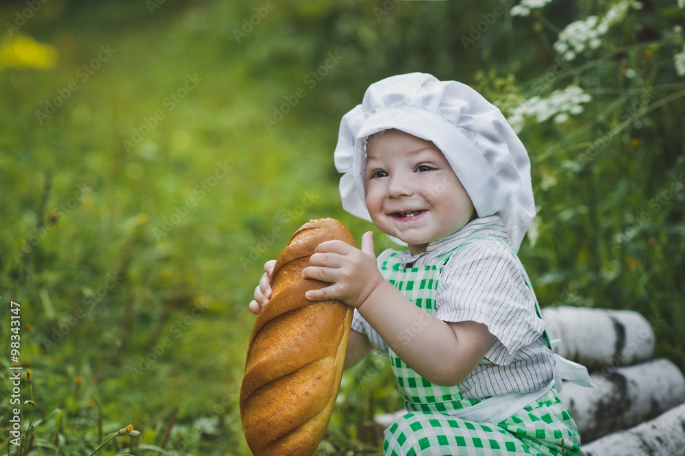 Child holding a loaf of bread 4702. Stock Photo | Adobe Stock