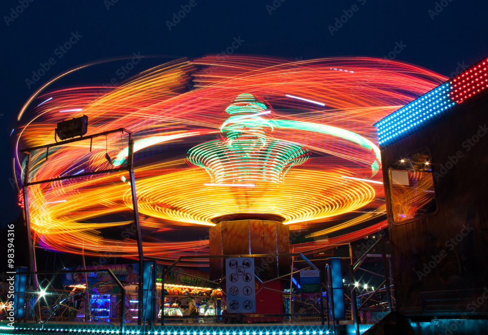 Carousels at night / The visitor amusement park, a very fun and fast ...