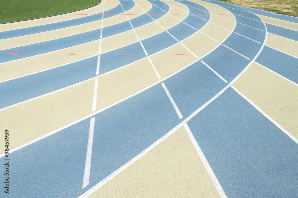 Modern running track background in blue and tan full frame close-up ...
