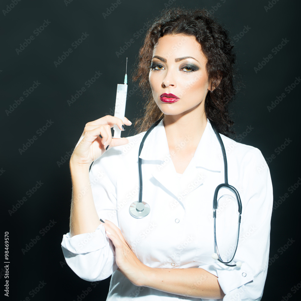 Woman with suringe Photos | Adobe Stock