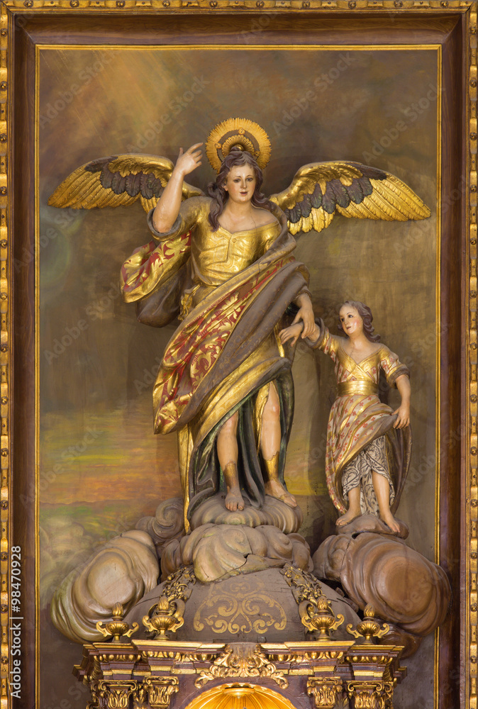 Cordoba - The carved polychrome statue of archangel Raphael Stock Photo ...