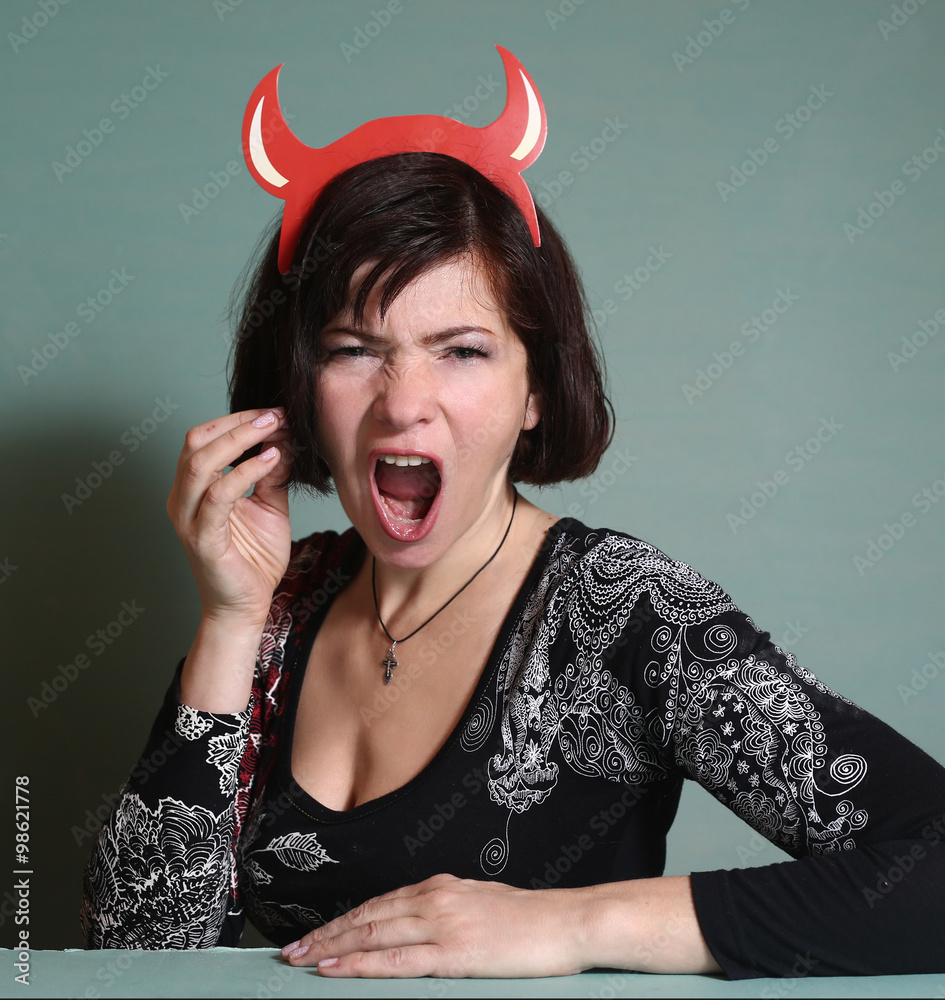 woman with halloween red horns Stock Photo | Adobe Stock