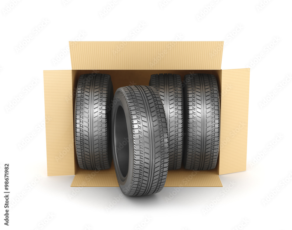 Stack of four new wheels in an open cardboard box isolated on wh Stock ...