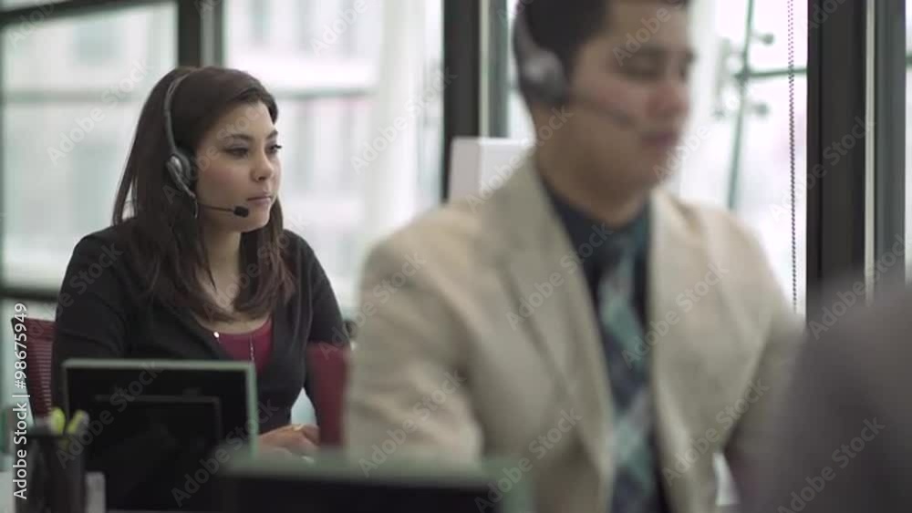 Professional in modern call center using headset and keyboard Stock ...