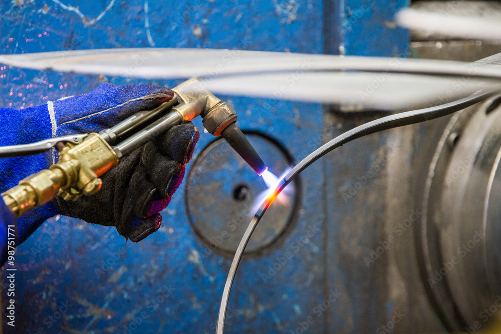 Oxyacetylene welding torch heating metal band to red hot Stock Photo ...