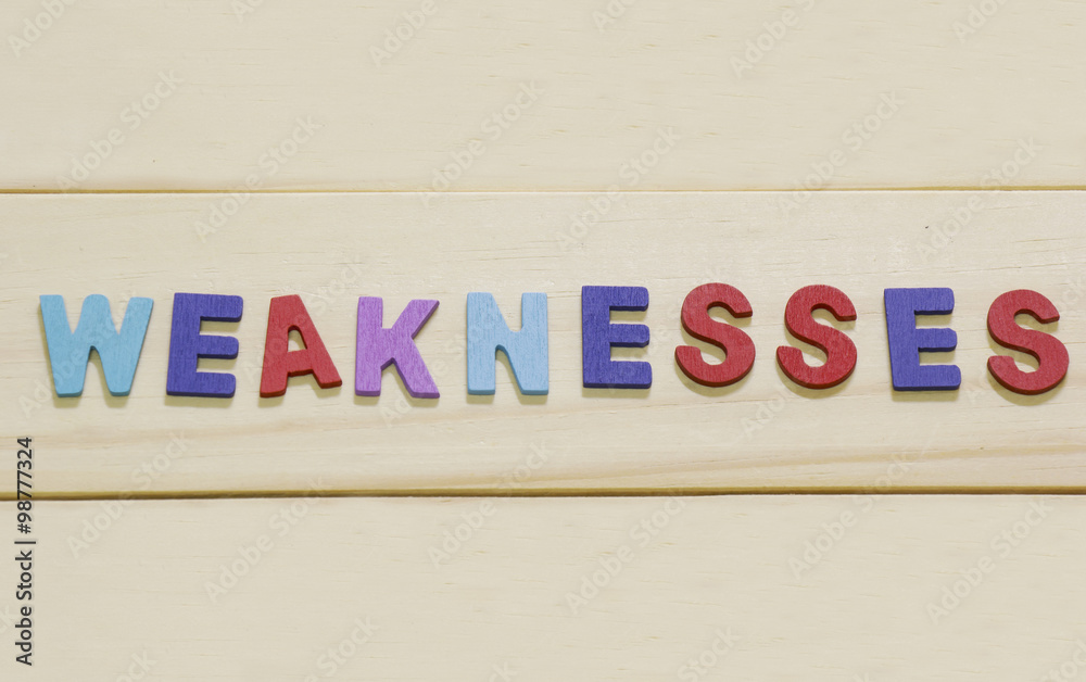 The colorful word "weaknesses" on wood background : SWOT Concept Stock Photo | Adobe Stock