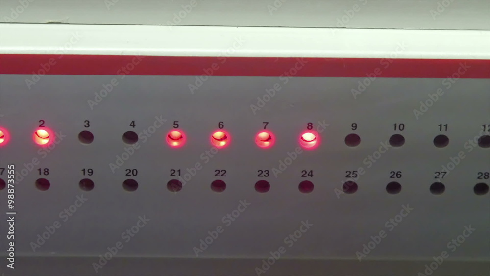Vidéo Stock Red led lights on the numbers in a wall. Lights indicating ...
