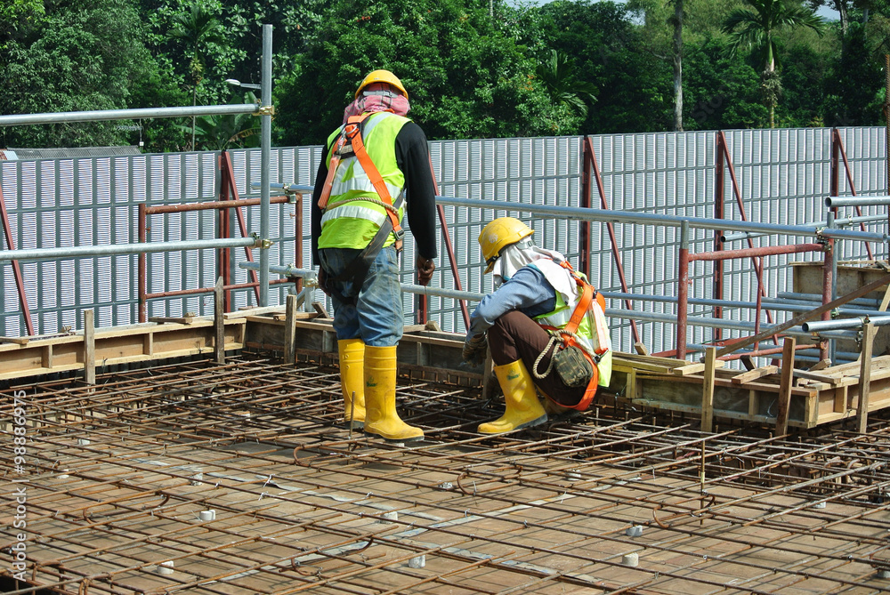 Construction workers fabricating floor slab reinforcement bar Stock ...