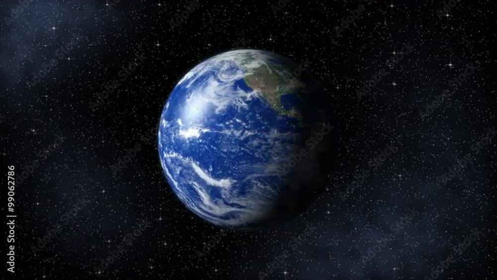 Planet Earth revolving against a background of stars. City lights can ...