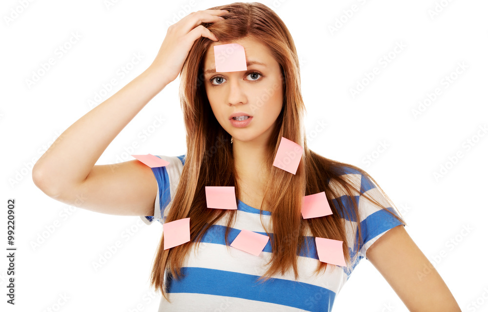 Teenage woman covered with post it notes Stock Photo | Adobe Stock