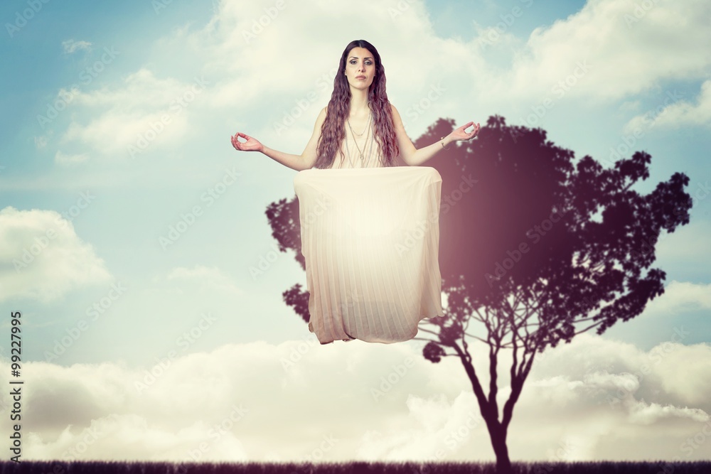 Composite image of portrait of beautiful woman levitating Stock Photo ...