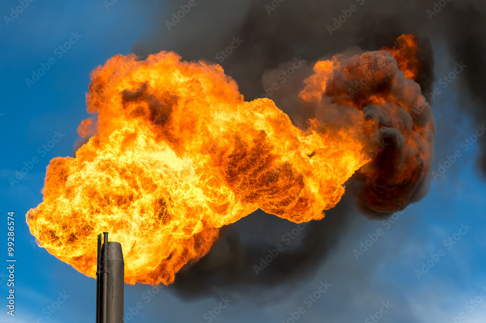 Gas flaring. Burning of associated gas at oil production. Stock Photo ...