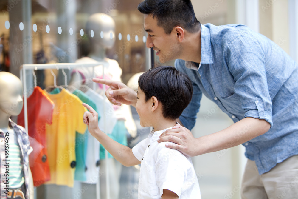 Father and son shopping in department store Stock Photo | Adobe Stock