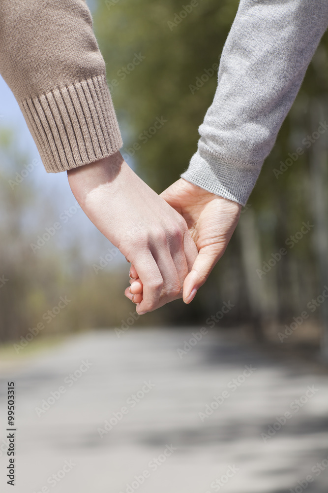 Young Couple Holding Hands