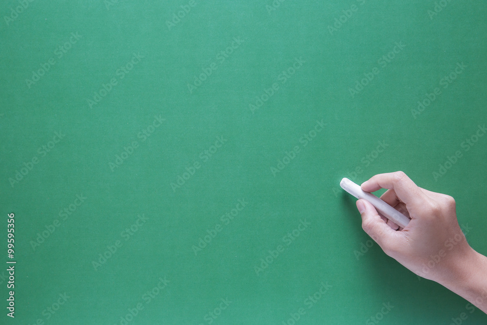 hand holding chalk with green chalk board background Stock Photo ...