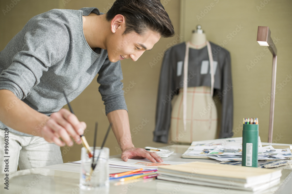 Fashion designer drawing sketch Stock Photo | Adobe Stock