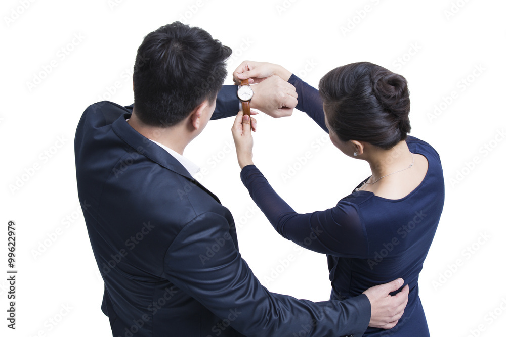 Wife putting on watch for husband Stock-Foto | Adobe Stock