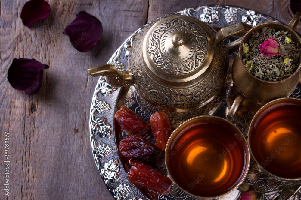 Traditional arabic tea set and dried dates. Stock Photo | Adobe Stock