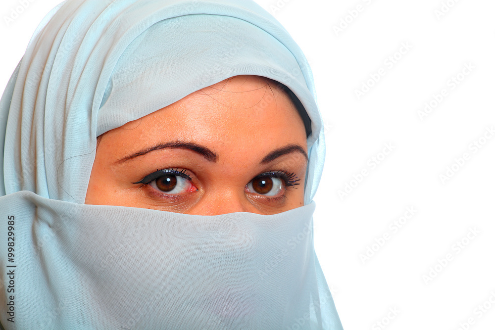 Young muslim woman with hide face. Studio portrait on white background ...