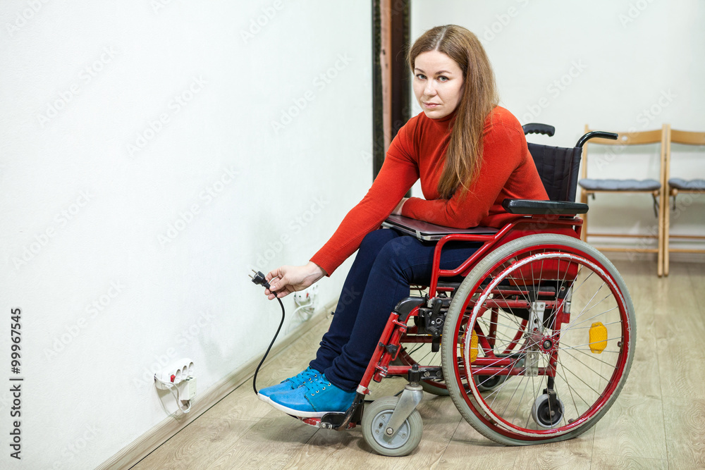 Disabled woman in invalid chair has some issues while inserting power ...