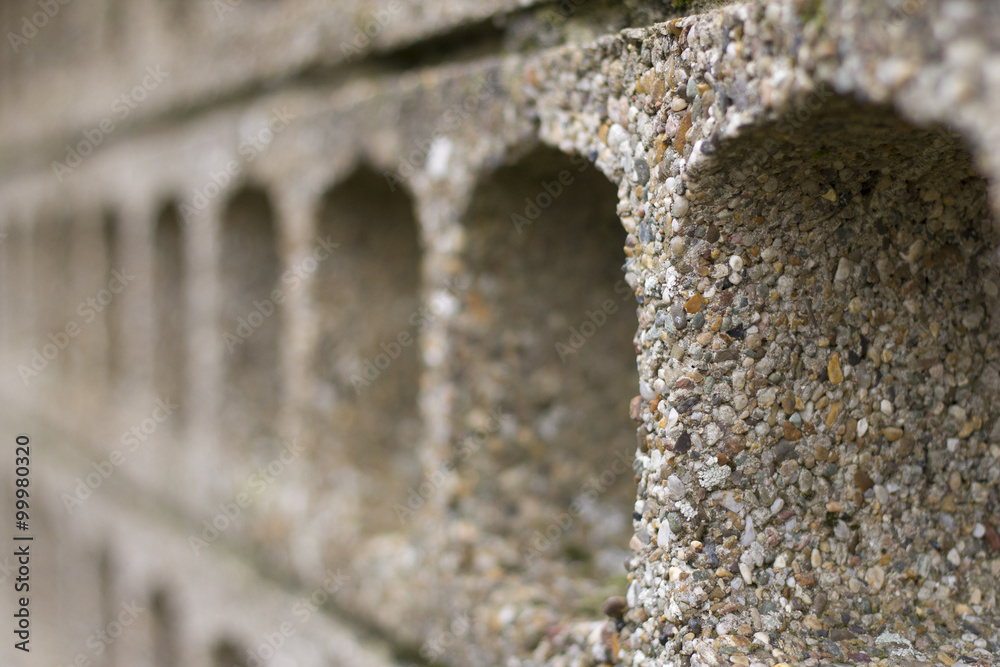 concrete wall with arched holes. artistic limited focus and blur. Stock ...