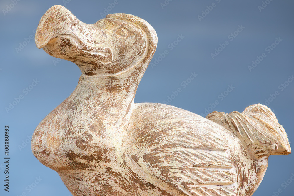 Wooden Dodo bird - typical souvenir from Mauritius island over the blue ...
