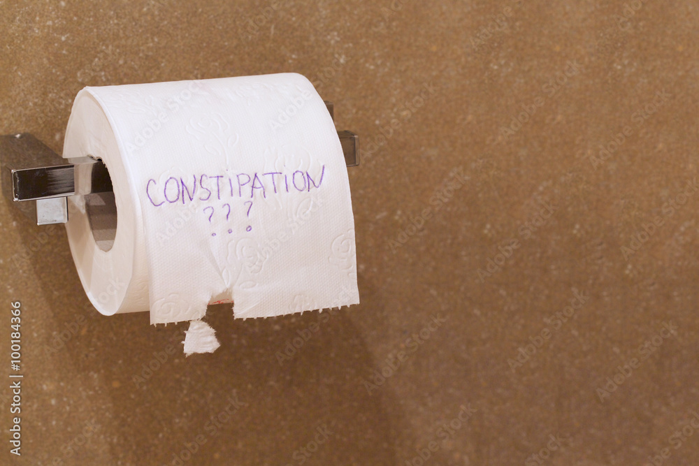The word constipation written on a tolet paper Stock Photo | Adobe Stock