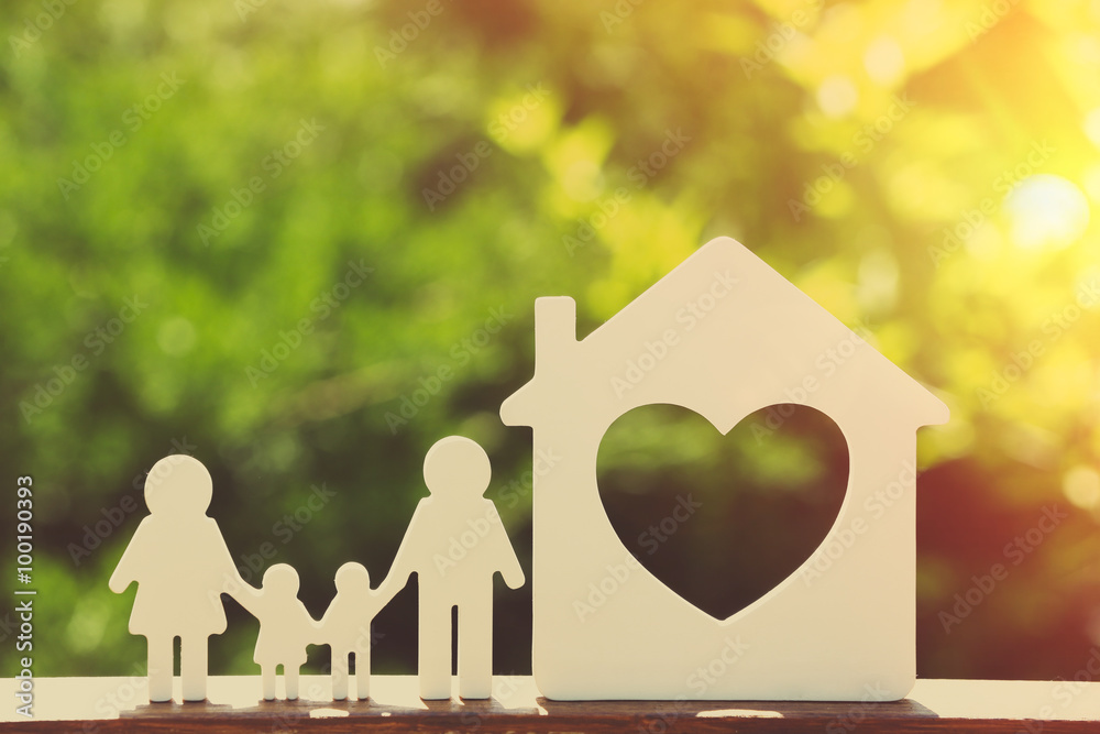 Small model of house and family on nature background Stock Photo ...