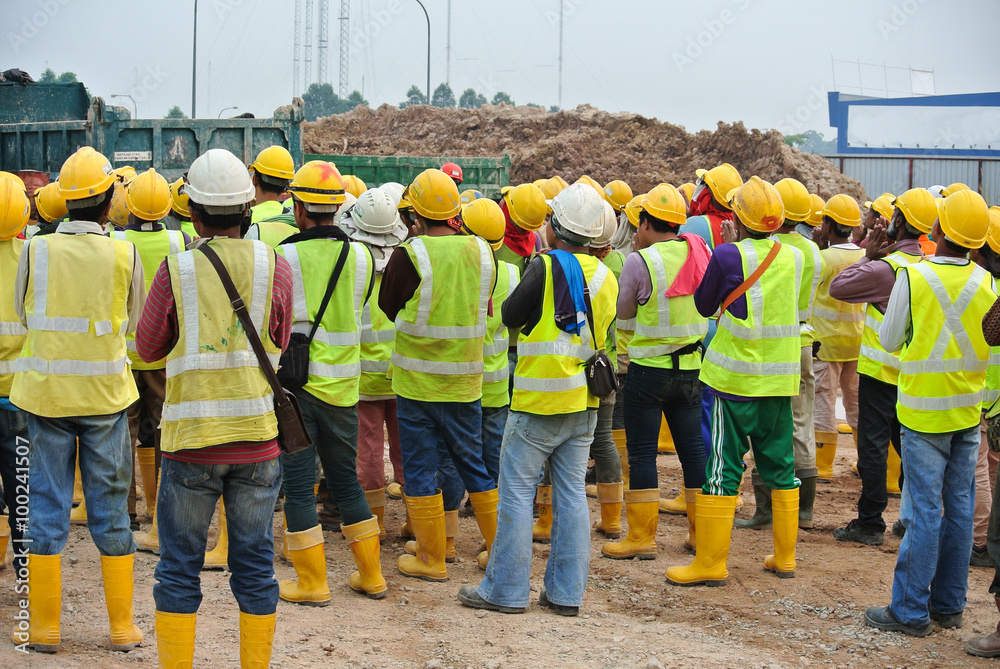 Group of construction workers assemble at the open space. Stock Photo ...