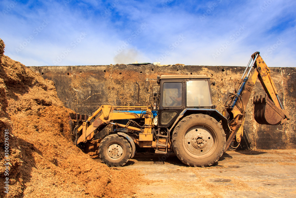 silo-loader tractor operates in deep silo trench Stock Photo | Adobe Stock
