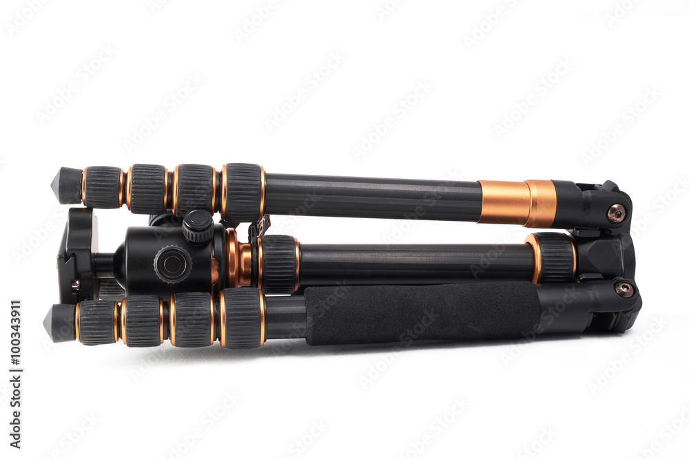 side view of a folded travel tripod made of carbon with twist lock ...
