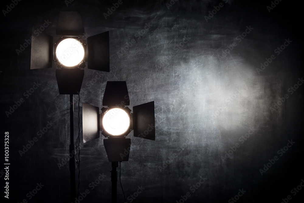 Lighting equipment on a black background old shabby wall Stock Photo ...