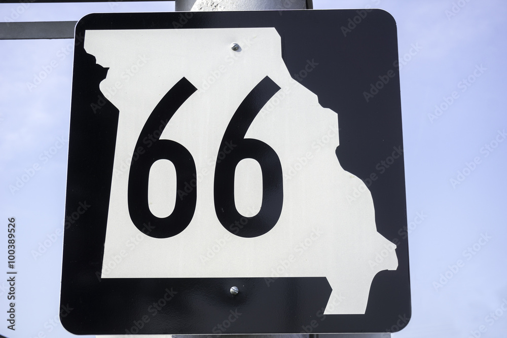 Missouri Route 66 signs in black and white against blue sky with ...